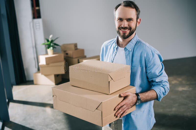Happy Bearded Man Holding Boxes and Smiling at Camera Stock Image ...