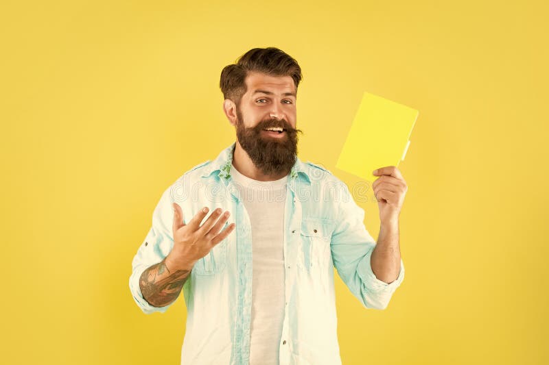 Happy Bearded Man Presenting Book on Yellow Background, Advertisement ...