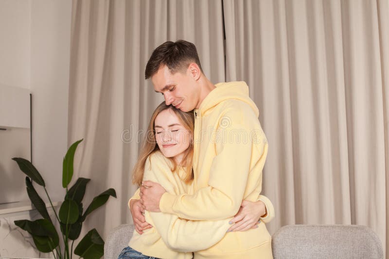 Happy Beautiful Couple in Yellow Clothes Hugging Stock Image - Image of ...