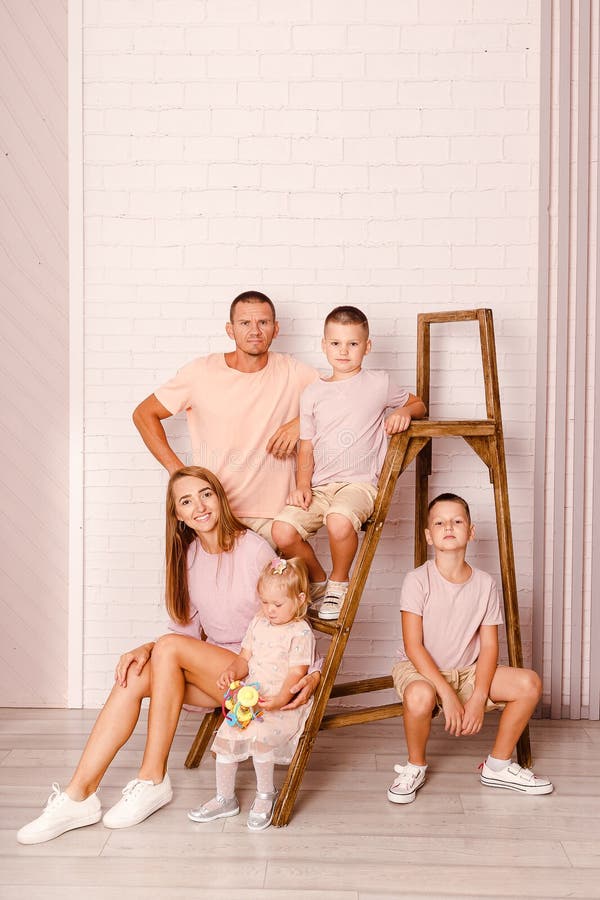 Happy Beautiful Family of Five in Light Pink Clothes Stock Image ...