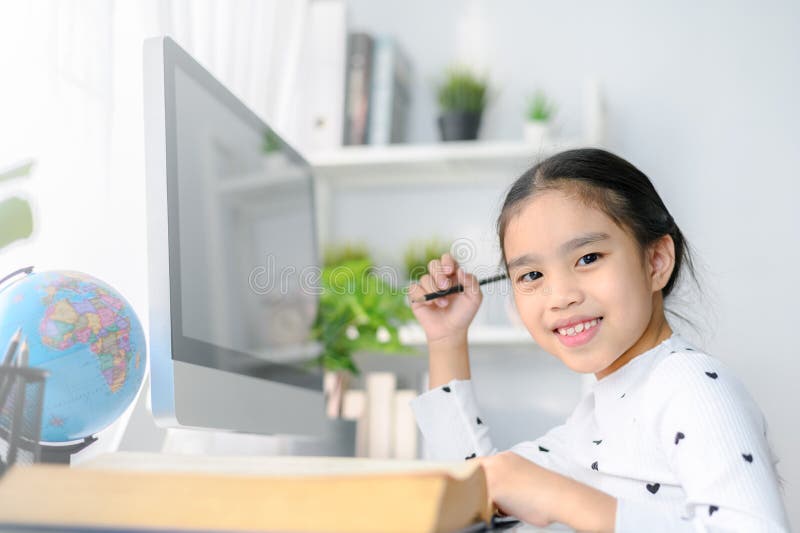 Happy Beautiful Little Girl Student Using Mobile Pad Computer Studying ...