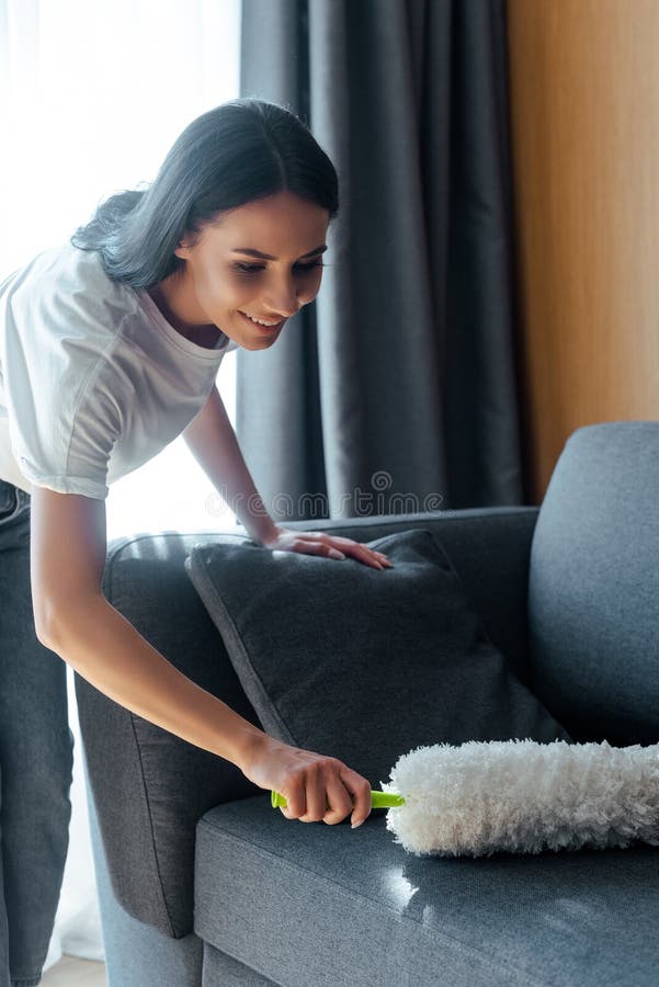Beautiful Woman Cleaning Dust from Sofa with Duster Stock Photo - Image ...