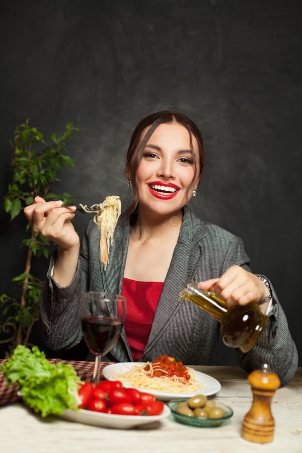 Happy Beautiful Woman Eating Italian Pasta In Restaurant Stock Image