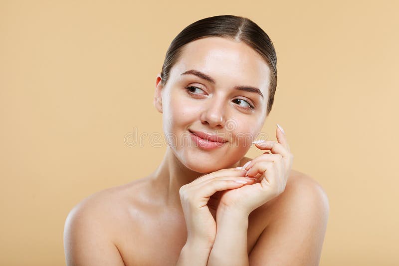 Happy Beautiful Woman Holding Her Cheeks A Laugh Looking To The Side
