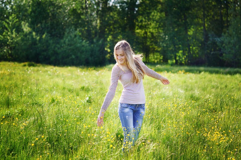 Happy Beautiful Woman Walking on a Spring Meadow Stock Image - Image of ...
