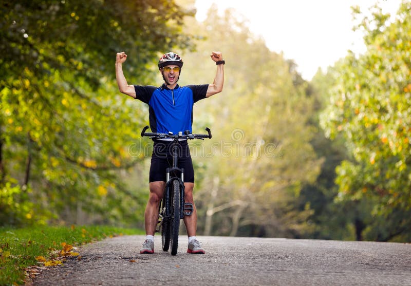 Happy Biker with Raised Hands Stock Photo - Image of happy, green ...