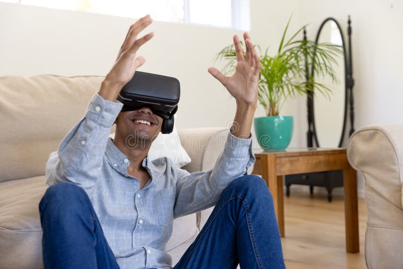 Happy Biracial Man Using Vr Headset Touching Virtual Screen at Home ...