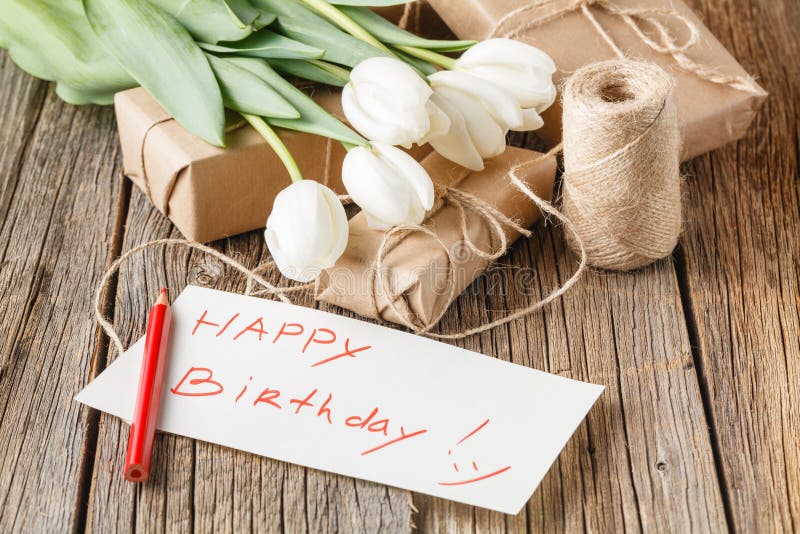 Happy Birthday Mesage with Flowers on Rustic Table with Flowers Stock ...
