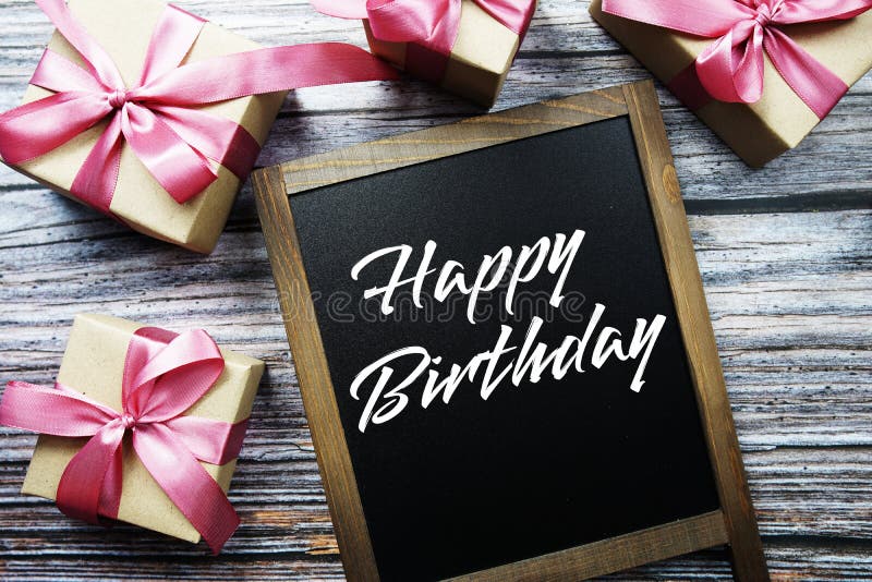 Happy Birthday Text on Blackboard with Gift Boxes on Wooden Background ...