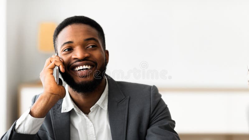 Happy Black Businessman Talking on Cellphone at Office Stock Photo ...