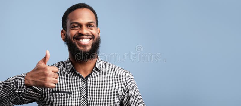 Happy Black Guy Gesturing Thumbs Up and Smiling Stock Photo - Image of ...