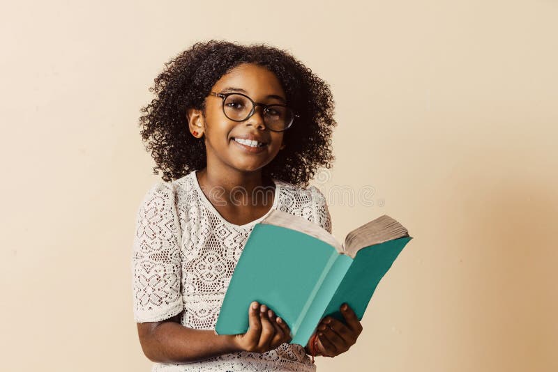 Happy Black Hispanic Child with Goggles Holding a Blue Book. Stock ...