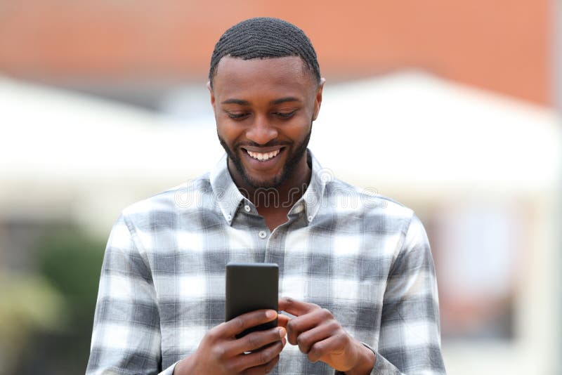 Happy Black Man Walking Using Smart Phone Stock Photo - Image of ...
