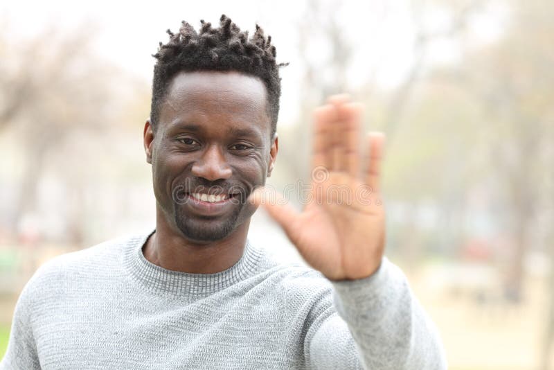 Happy Black Man Waving Hand Looking Camera Stock Photo - Image of ...