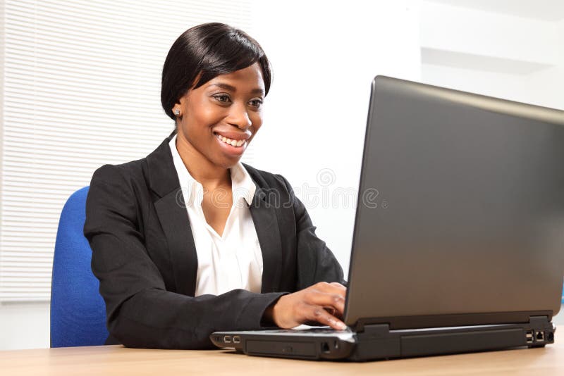 Happy Black Woman Using Laptop at Office Desk Stock Photo - Image of ...