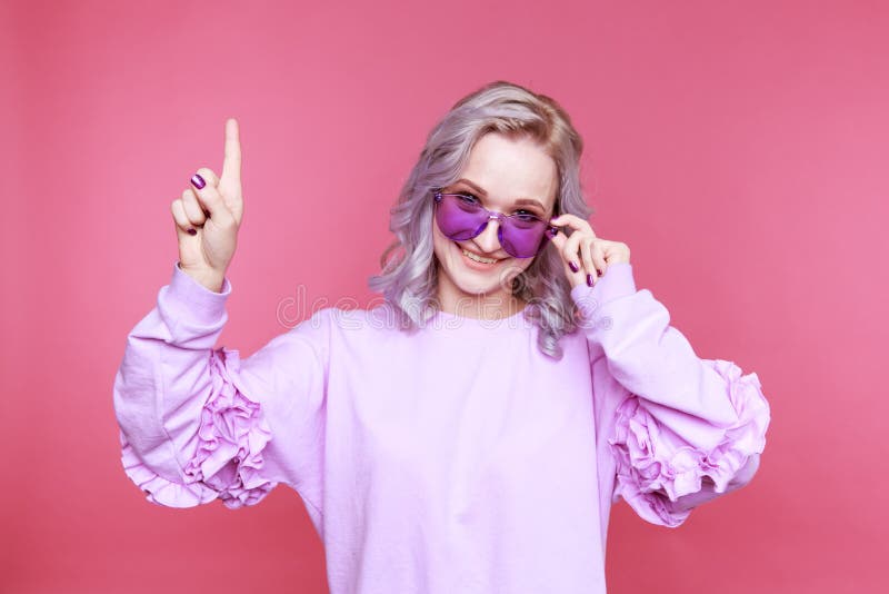 Happy Blond Model Showing by Finger Up Sstanding in the Pink Studio ...