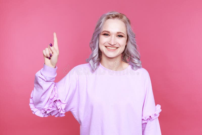 Happy Blond Model Showing by Finger Up Sstanding in the Pink Studio ...