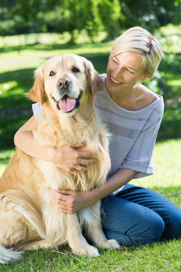 Happy Blonde Hugging Her Dog in the Park Stock Image - Image of happy ...
