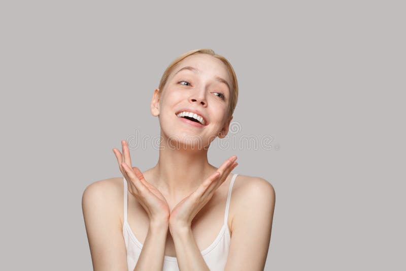 Happy Blonde Woman Smiling Isolated on Grey Stock Photo - Image of ...