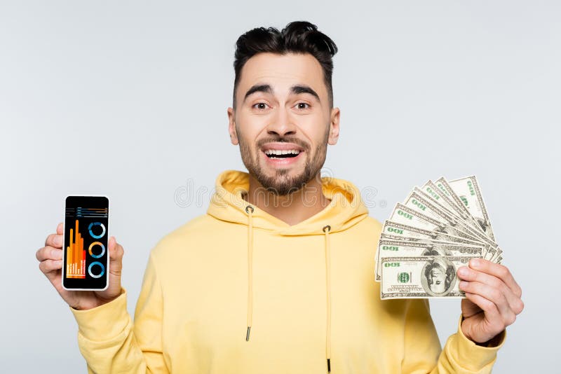 Happy Bookmaker with Dollars Showing Smartphone Stock Photo - Image of ...
