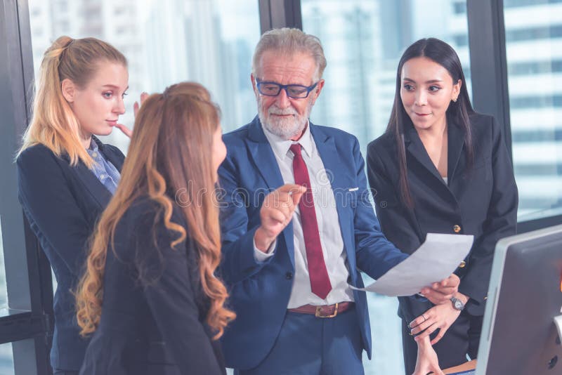 A Happy Boss Helping Officer in Multiculture Office Stock Photo - Image ...