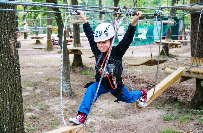 Happy Boy in Adventure Park Stock Photo - Image of equipment, risk ...