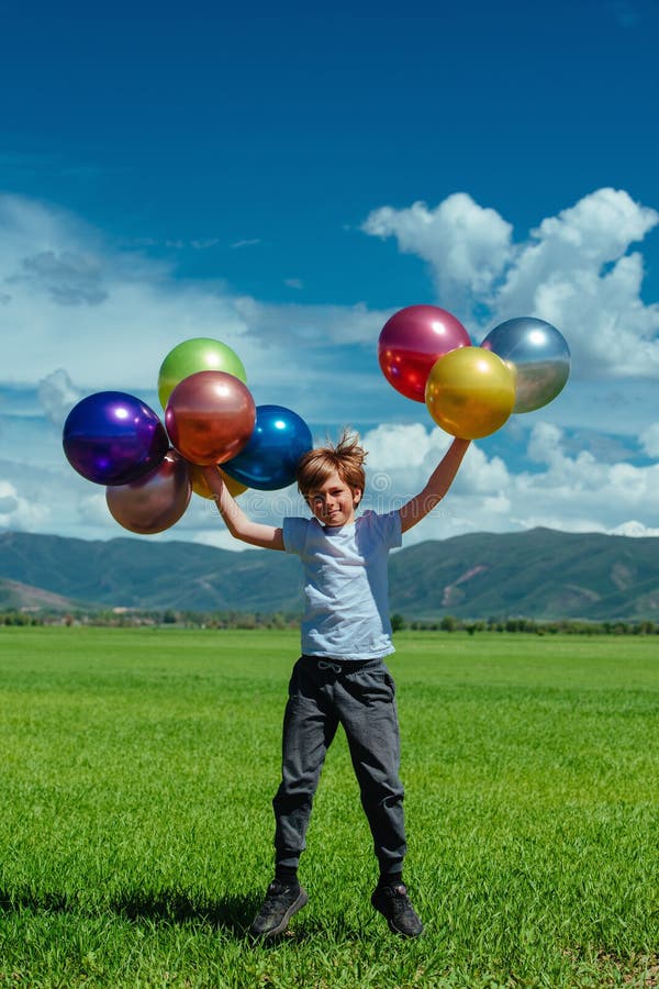 Happy Boy with Balloons on Summer Field Stock Image - Image of ...