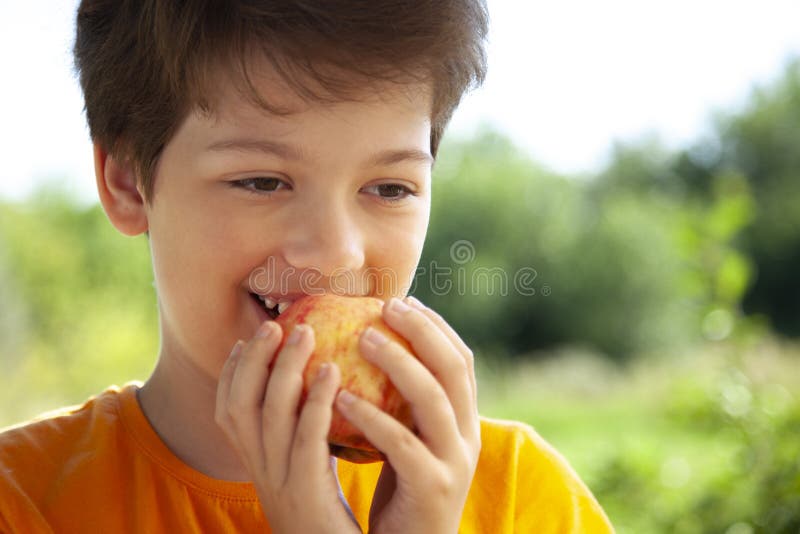 Happy Boy Biting the Apple, a Child with a Fruit. Kid Eating Fresh Pear ...