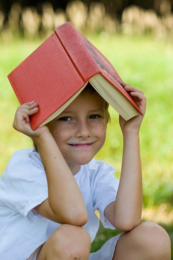 Happy boy with a book stock photo. Image of happy, play - 15378376