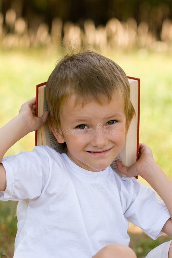 Happy Boy with a Book Outdoors Stock Image - Image of life, healthy ...