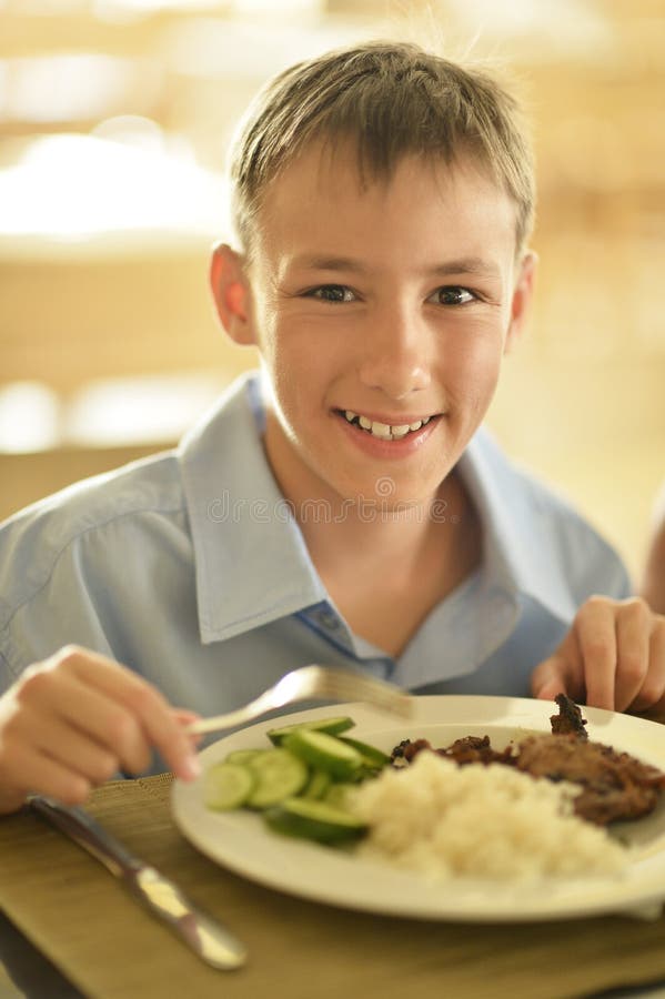 Happy boy at breakfast stock image. Image of nice, positive - 52331937