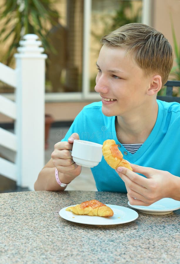 Happy boy at breakfast stock photo. Image of cafe, positive - 53301462