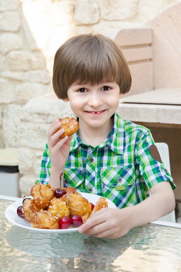Happy boy with cakes stock photo. Image of preschooler - 44211238