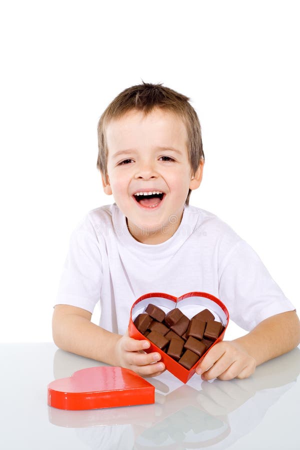 Happy boy with chocolate stock photo. Image of occasion - 7965874