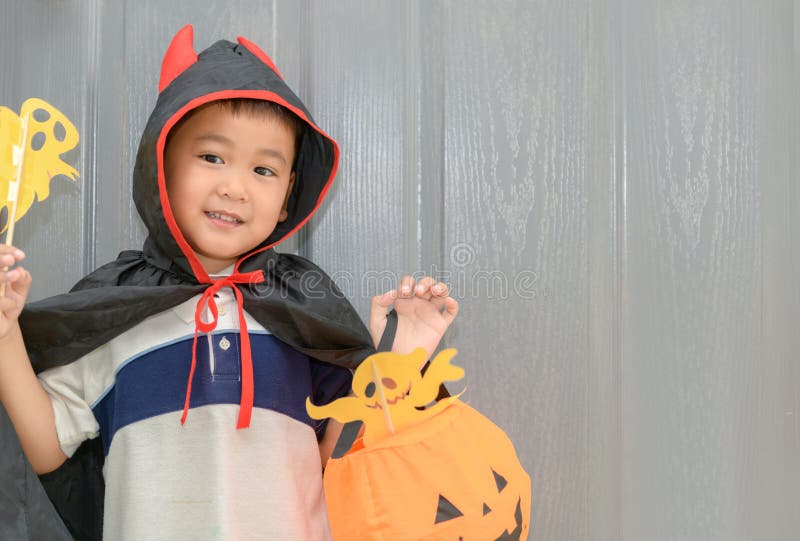 Boy Devil Smile and Playing Paper Ghost Stock Image - Image of holiday ...
