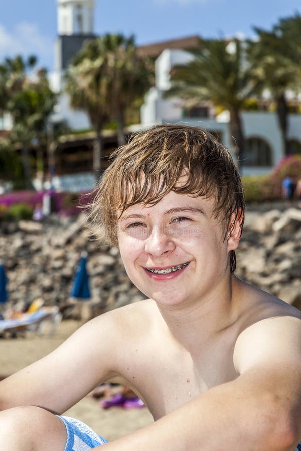 Happy Boy Enjoys Sitting at the Beach Stock Image - Image of portrait ...