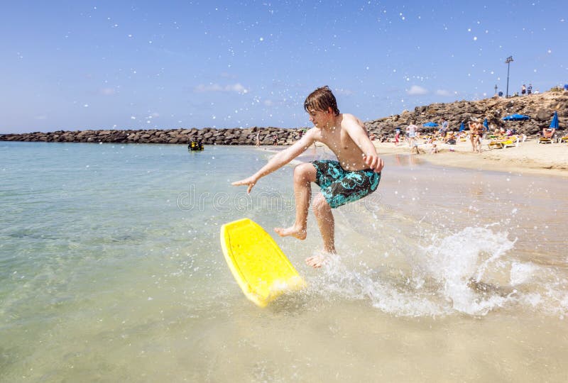 Happy boy enjoys surfing stock image. Image of lifestyle - 26532083