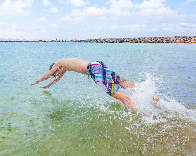 Happy boy enjoys surfing stock image. Image of male, jump - 38402907