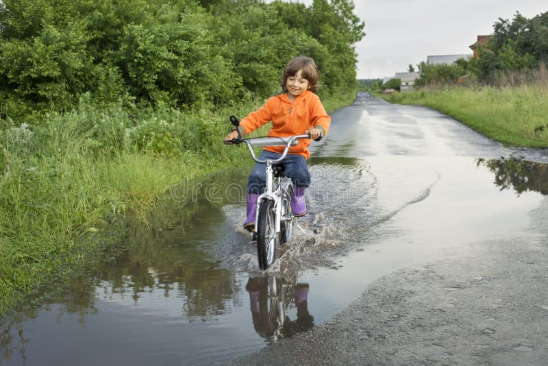 Happy Boy Going through a Puddle Stock Image - Image of happiness ...
