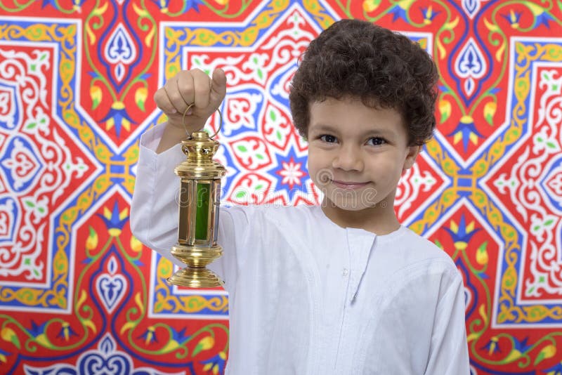 Happy Boy with Golden Lantern Celebrating Ramadan Stock Photo - Image ...