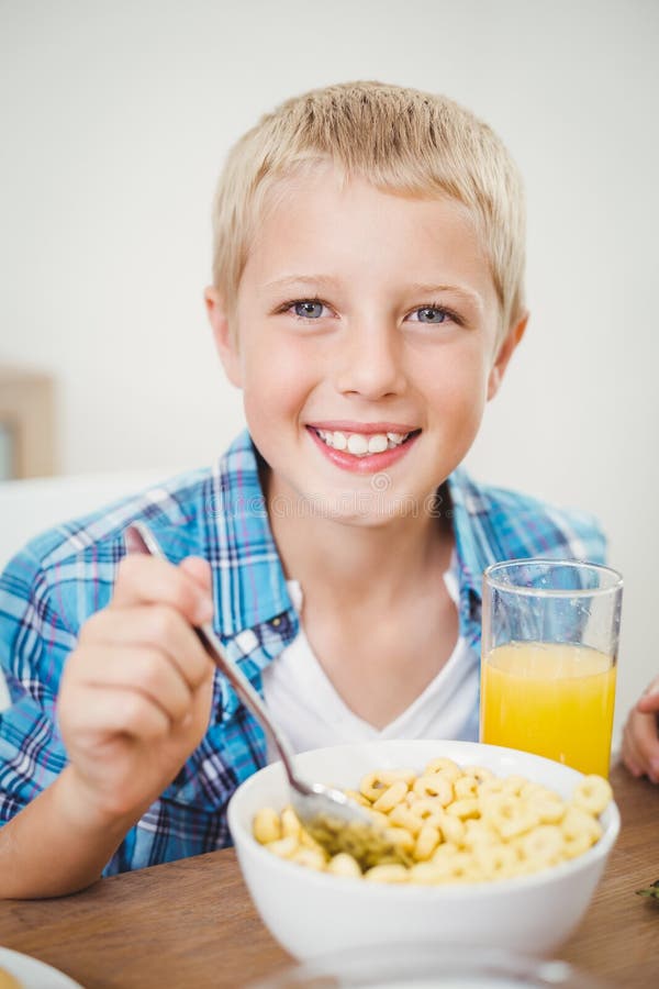 Happy Boy Having Breakfast at Table in House Stock Image - Image of ...