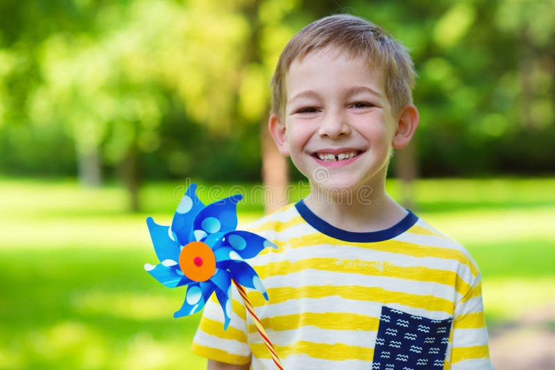 Happy Boy Holds Windmill Hand Stock Photos - Free & Royalty-Free Stock ...