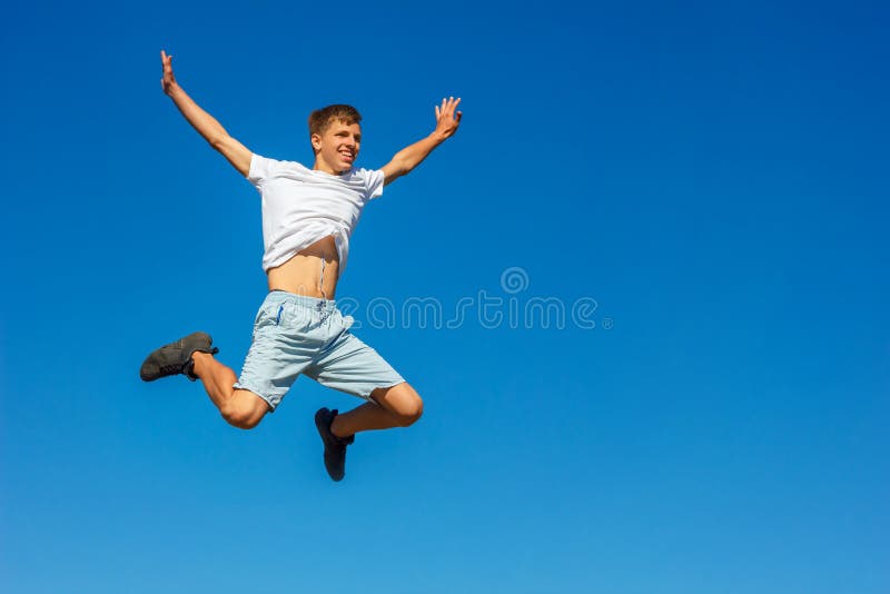 Happy Boy Jumping in the Blue Sky , Concept of Happiness Stock Image ...