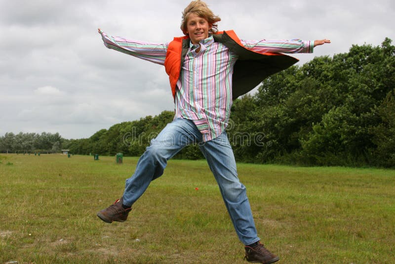 Happy boy jumping for joy stock image. Image of child, teens - 183333