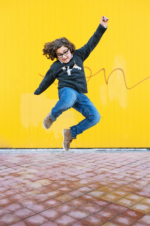 Happy boy jumping. stock photo. Image of childhood, style - 90092010