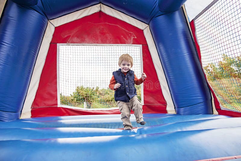 Happy boy jumping stock photo. Image of playing, toddler - 61046496