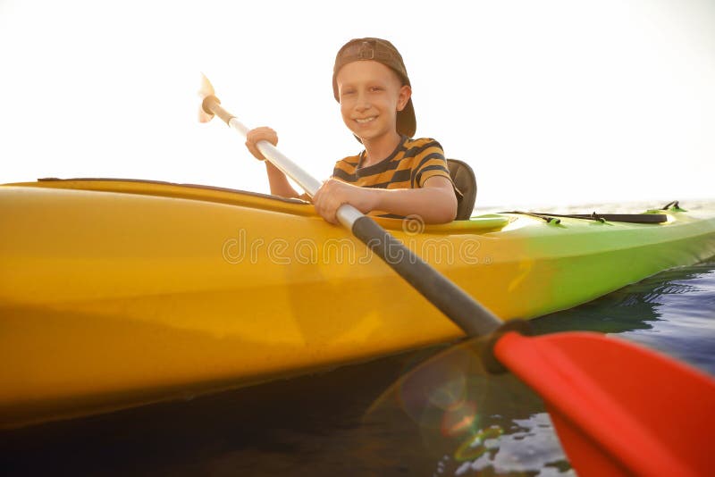Happy Little Boy Kayaking on River. Summer Camp Activity Stock Image ...