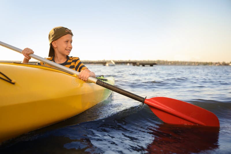 Happy Little Boy Kayaking on River. Summer Camp Activity Stock Photo ...