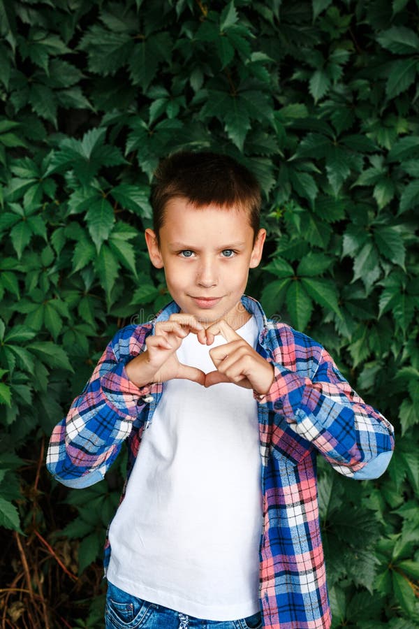 Happy Boy Making a Heart Shape with His Hands Stock Image - Image of ...