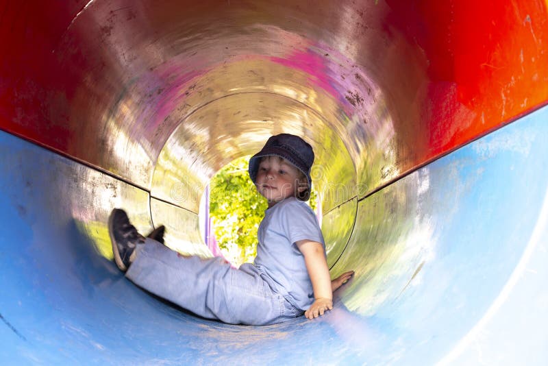 Happy boy on playground stock photo. Image of people - 210664532
